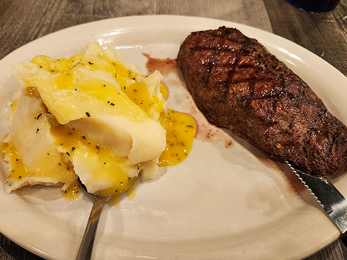 A perfectly grilled sirloin with buttery mashed potatoes &ndash; proof that sometimes the simplest pleasures are the most profound.