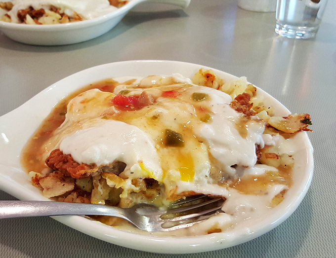 This isn't just breakfast&mdash;it's a beautiful disaster of eggs, potatoes, and green chili that would make your cardiologist wince and your taste buds sing.