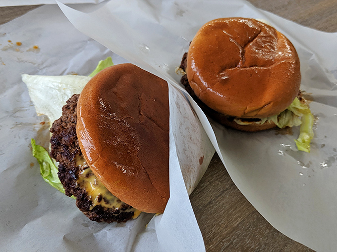 Two perfectly crafted burgers, simply dressed and ready for their close-up. No Instagram filter needed for this kind of natural beauty.