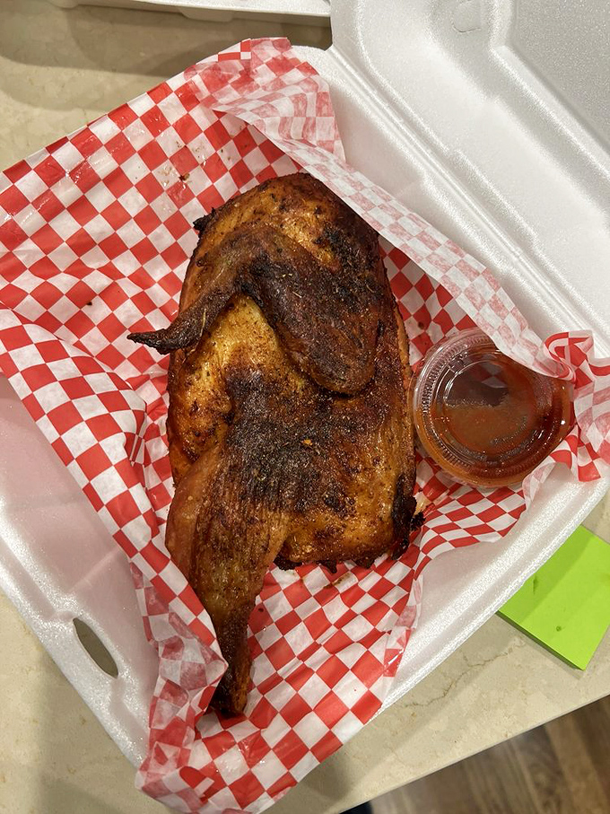 Behold the smoked chicken in its to-go glory, sporting a bark so beautiful it could make a pitmaster weep with joy.