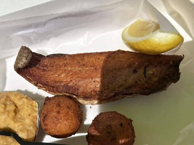 Florida on a plate. Perfectly smoked mullet with hush puppies represents Old Florida cuisine at its unpretentious best.