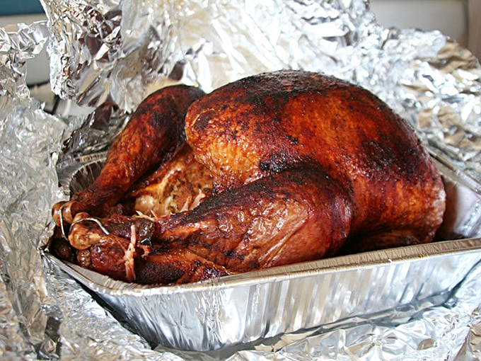 A smoked turkey that defies the "dry poultry" stereotype, glistening with flavor that proves Thanksgiving should never be limited to November.