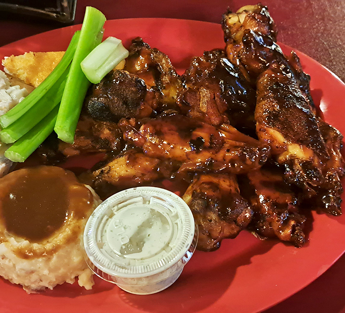 These aren't just wings; they're smoky masterpieces that have achieved that perfect mahogany hue that BBQ dreams are made of.