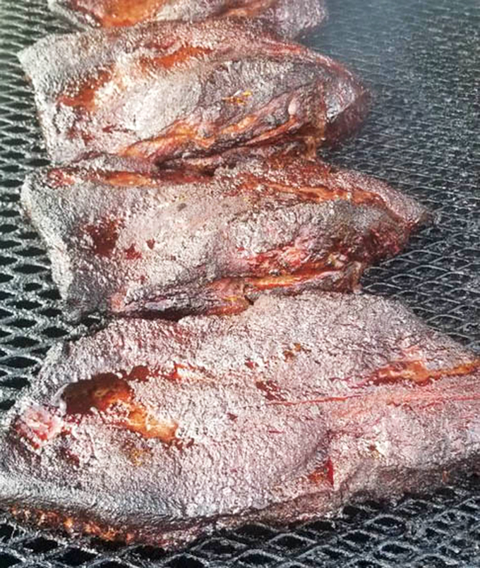 Smoke rings don't lie. This brisket has been slow-dancing with hickory smoke until it achieved tender, bark-crusted perfection.