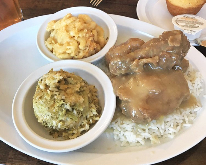 Smothered chicken that doesn't just melt in your mouth&mdash;it tells a story. Those sides aren't accompaniments; they're co-stars in this comfort food blockbuster.