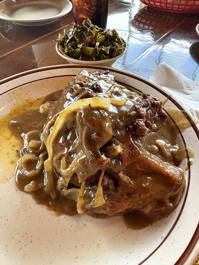 Smothered chicken swimming in gravy so good you'll want to bottle it. Comfort food that hugs you from the inside.