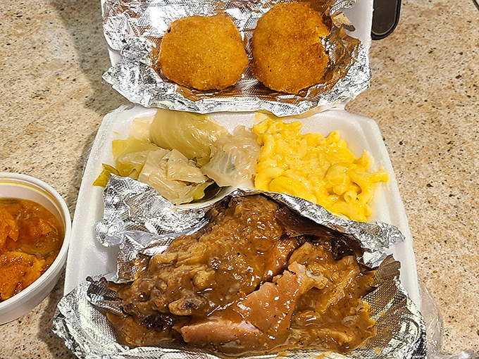 Smothered pork chops swimming in gravy with cabbage and mac and cheese&mdash;comfort food that hugs you from the inside out. 