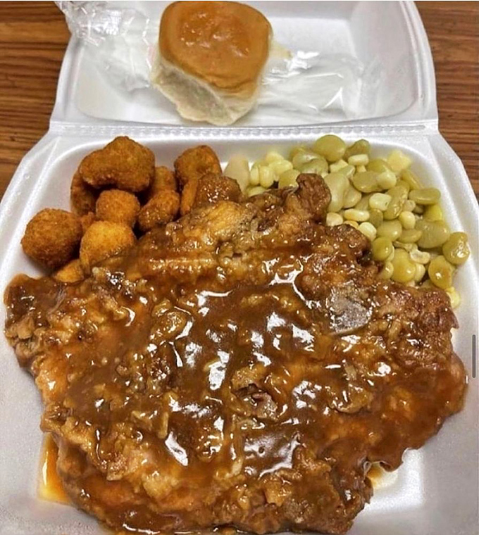 A meal that demands both a fork and respect. These smothered pork chops with okra and corn represent generations of culinary wisdom in every bite.