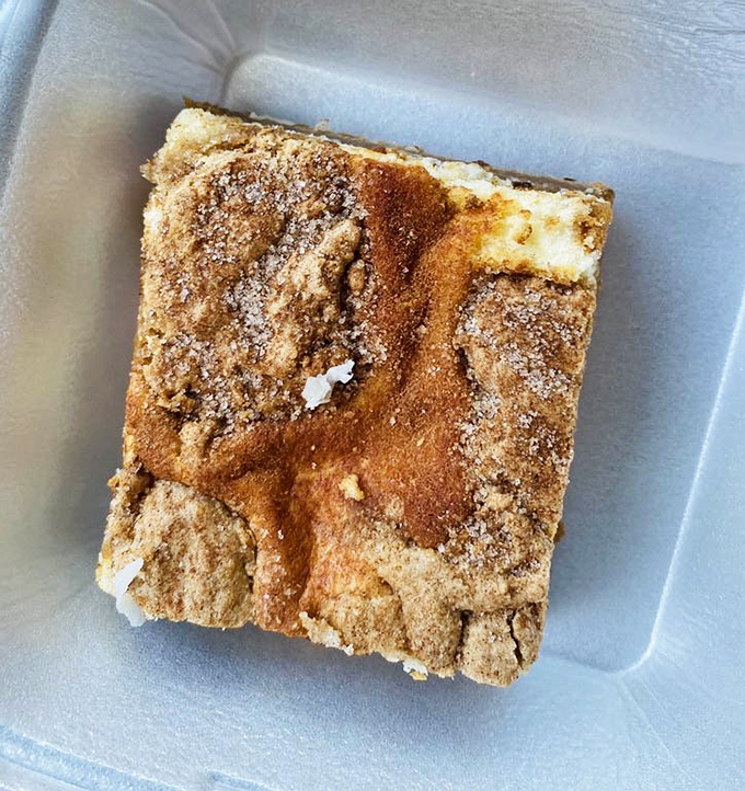 This cinnamon-swirled square of heaven isn't just a dessert; it's an edible argument against moderation.