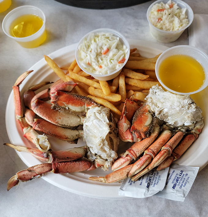 Snow crab legs so impressive they deserve their own zip code, accompanied by the classic trio of fries, coleslaw, and drawn butter for dunking.
