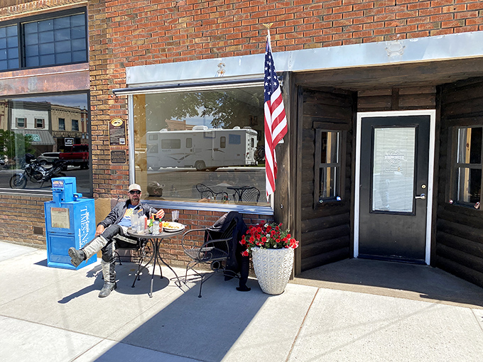 Nothing says "small-town charm" quite like wrought-iron benches and vibrant flowers lining a walkway where neighbors still greet each other by name.