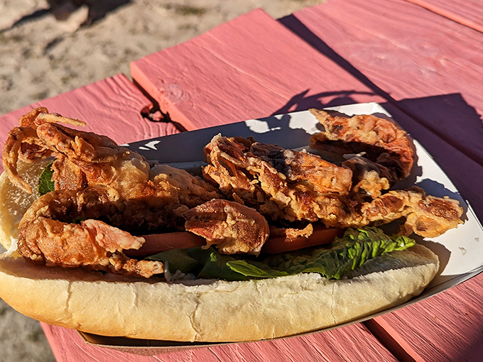 Soft shell crab sandwich: that magical moment when "you can eat the whole thing" isn't just permission&mdash;it's a delicious recommendation. Crunchy, tender, and gloriously messy.
