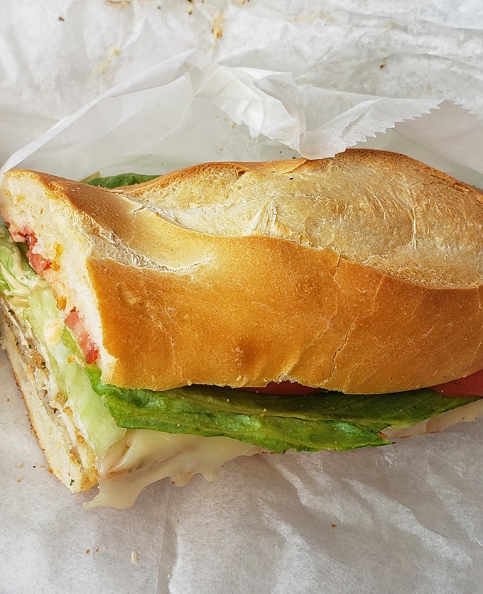 This isn't just a sandwich&mdash;it's a masterclass in texture and balance. Crisp bread, fresh veggies, and savory fillings create the holy trinity of lunch.