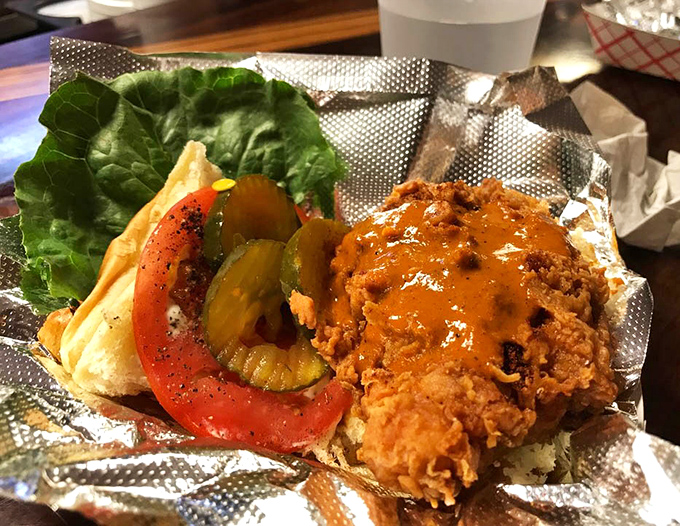 This fried chicken sandwich isn't just a meal&mdash;it's an event. That golden crust practically sings against the fresh vegetables and soft bun.