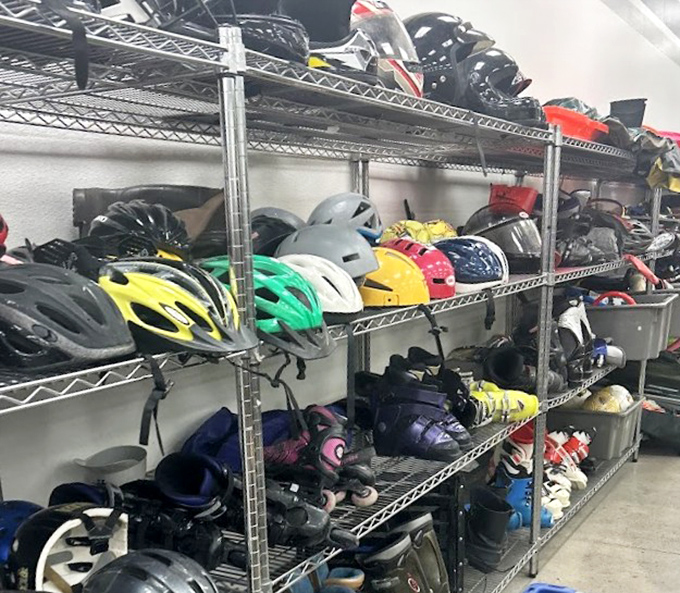 Helmets and sports gear line the shelves like retired athletes, each with stories of mountain trails conquered and neighborhood victories won.