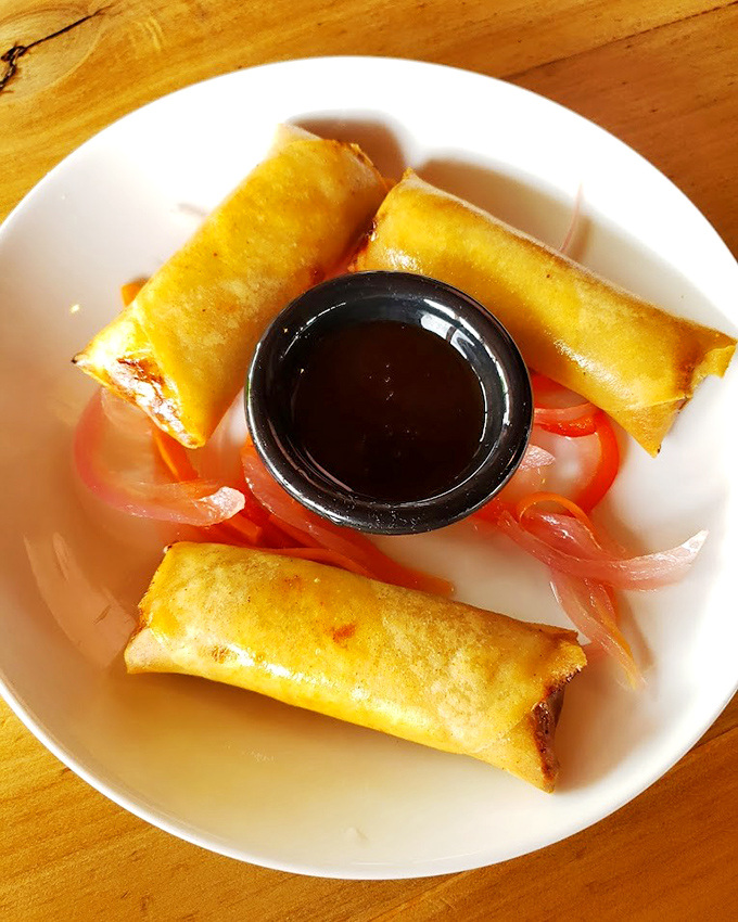 These spring rolls aren't just appetizers; they're the opening act to a culinary concert, complete with a dipping sauce worthy of its own standing ovation.