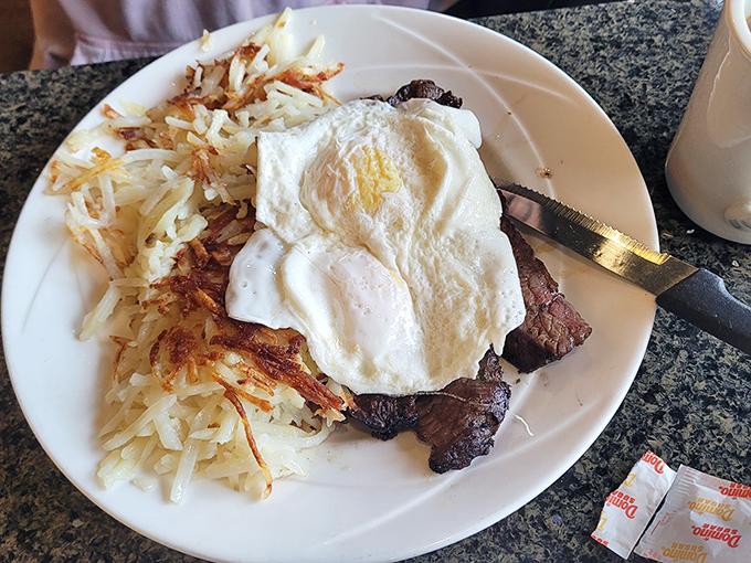 When steak and eggs join forces, it's not breakfast&mdash;it's a power move. Those hash browns are the supporting actors who steal the scene.