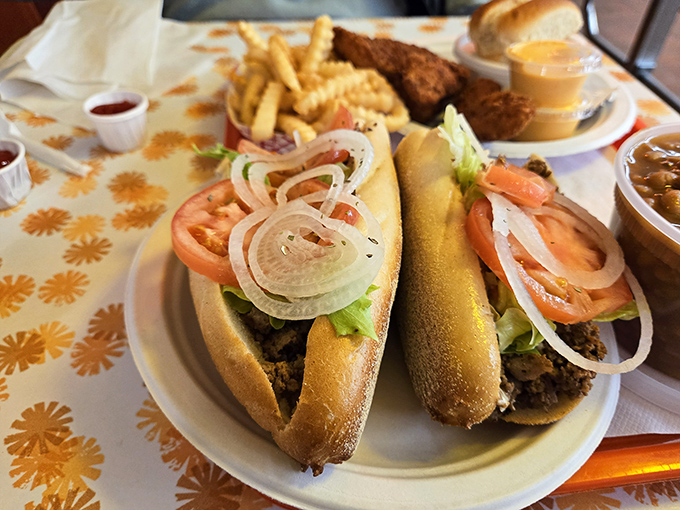 Two hoagies lounging on a plate like they own the place, dressed with the confidence of sandwiches that know they're irresistible.