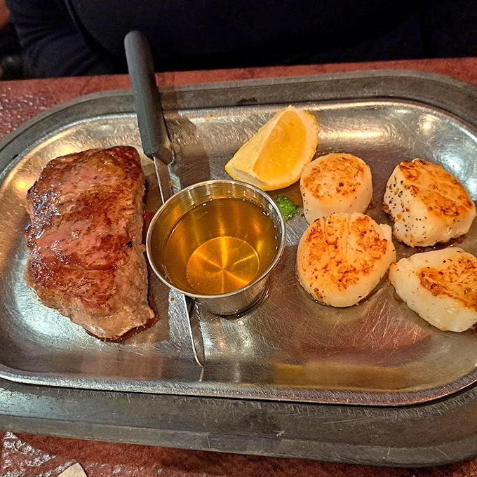 Surf meets turf in perfect harmony &ndash; a steak cooked exactly as promised alongside scallops with that coveted caramelized crust. Ocean and pasture, united at last.