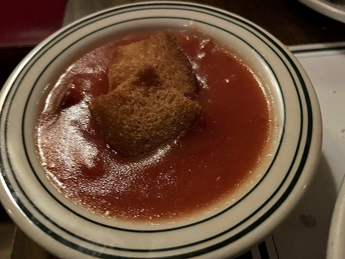 Those legendary stewed tomatoes—sweet, tangy, and topped with a crouton that soaks up the goodness like a tasty little sponge.