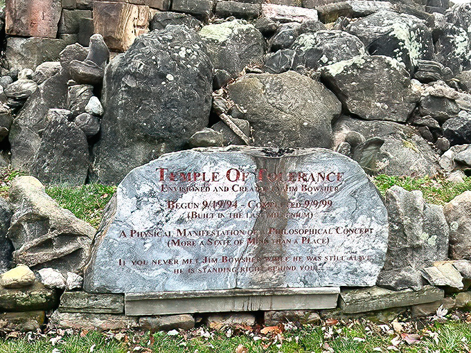 The garden's origin story etched in stone &ndash; a physical manifestation of philosophical concepts that began in 1994 and continues evolving today.