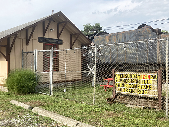 The Worthington station sign welcomes visitors, while a hand-painted board announces summer rides for the young and young-at-heart.