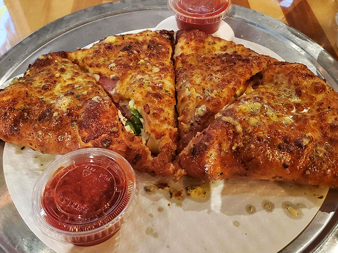 This stromboli isn't just a meal &ndash; it's an event. Golden-brown crust giving way to a molten interior of cheese and savory fillings. Napkins required, no sharing advised.