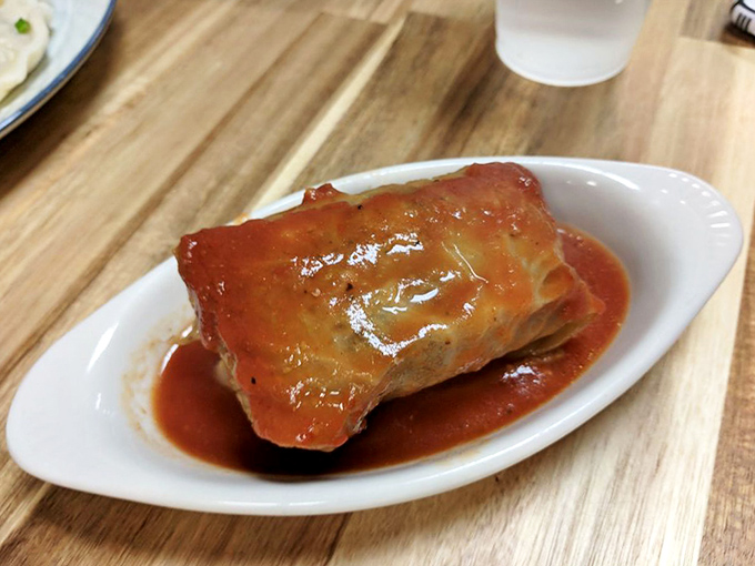 Behold the golabki in all its glory! This stuffed cabbage roll isn't just dinner; it's a warm Polish hug wrapped in tomato sauce.
