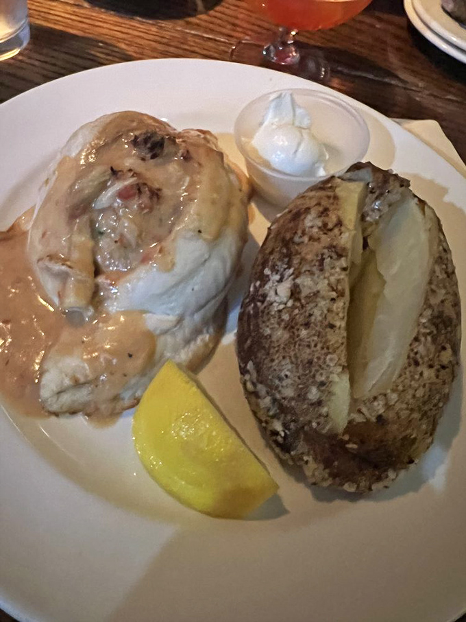 The stuffed flounder arrives looking like it's had a spa day in butter. That lemon wedge isn't garnish&mdash;it's the golden key to perfection.