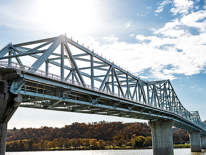 The bridge spanning the Ohio doesn't just connect Kentucky and Indiana—it frames the perfect entrance to Madison's storybook setting.