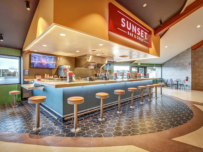 Step inside the Sunset Bar & Grill where mid-century modern meets movie munchies, complete with counter seating perfect for pre-show dining.