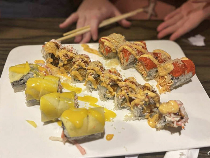 Sushi that dresses better than most of us on a Friday night. These vibrant rolls aren't just Instagram-worthy; they're a flavor party where everyone's invited.