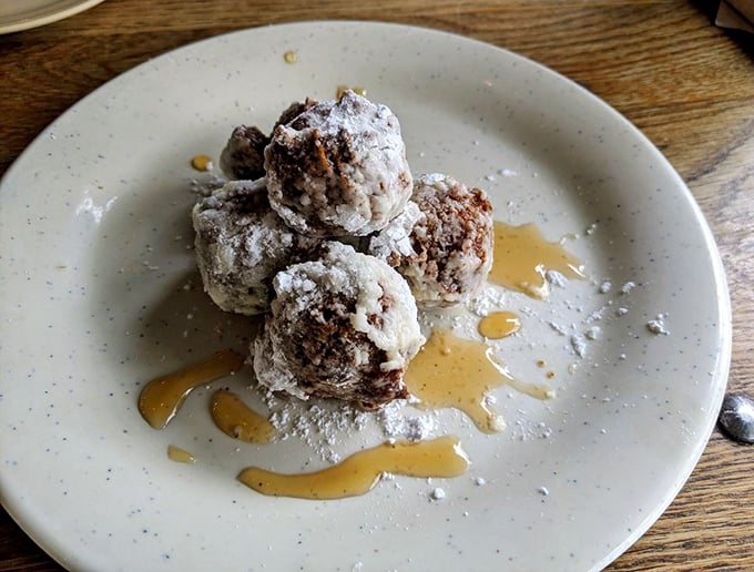 Sweet potato beignets drizzled with maple syrup&mdash;proof that vegetables can have exciting second careers as dessert. These little spheres of joy demand attention.