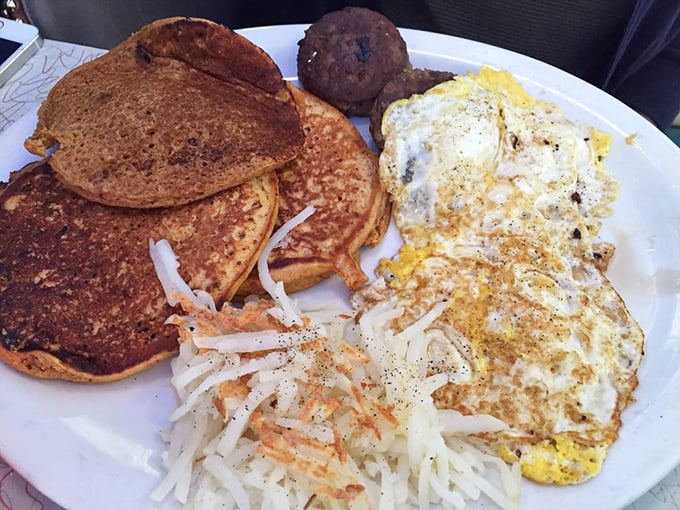 Breakfast alchemy at its finest: sweet potato pancakes sharing plate space with eggs and hash browns&mdash;a morning trilogy that rivals Lord of the Rings for epic satisfaction.