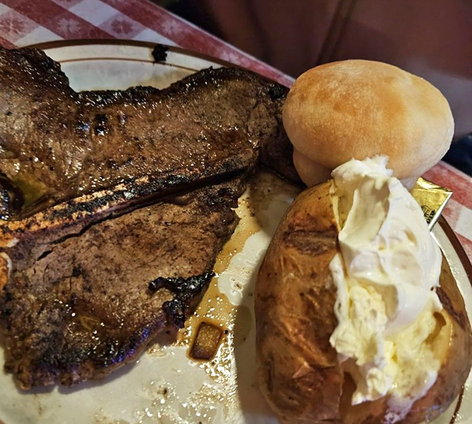 T-bone steak with a baked potato so perfectly dressed it could be featured in Potato Fashion Weekly, if that were a thing.