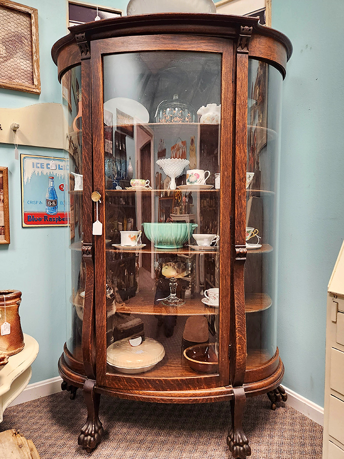 This curved-glass cabinet isn't just furniture&mdash;it's a Victorian Instagram, displaying one family's finest china and conversation pieces for over a century.