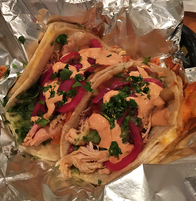 Tacos that refuse to be pigeonholed into any single barbecue tradition. That pink sauce isn't just pretty&mdash;it's a flavor revelation waiting to happen.