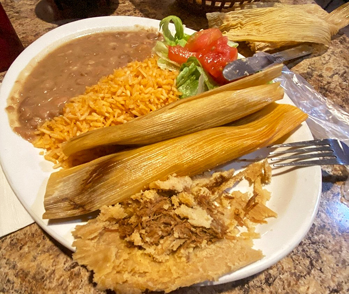 Tamales wrapped like precious gifts in corn husks. Unwrap to discover the tender masa treasure within &ndash; comfort food that transcends borders.