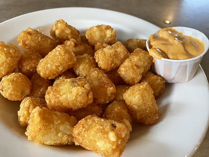 These aren't your cafeteria tater tots. They're golden-brown nuggets of potato perfection that crunch then yield, served with a dipping sauce worth fighting over.