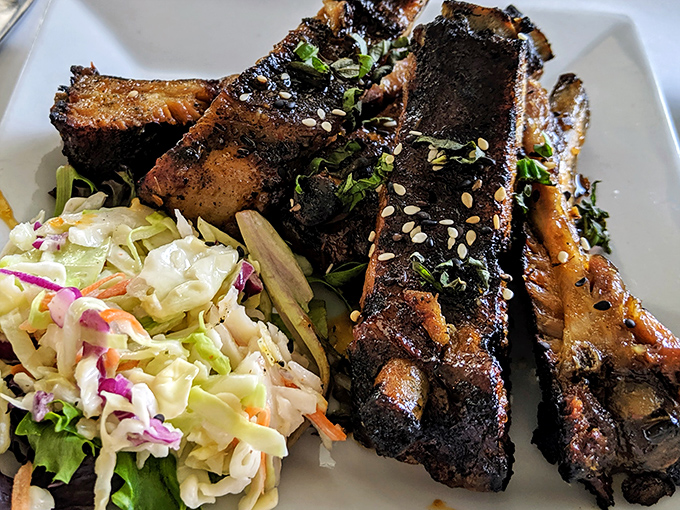 Thai ribs that fall off the bone with such enthusiasm they practically jump onto your fork, flanked by slaw that cuts the richness perfectly.