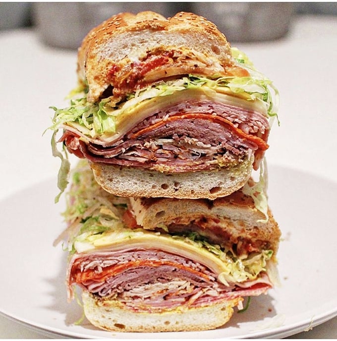 The cross-section tells the whole story: this isn't just a sandwich, it's a geological expedition through strata of deliciousness.