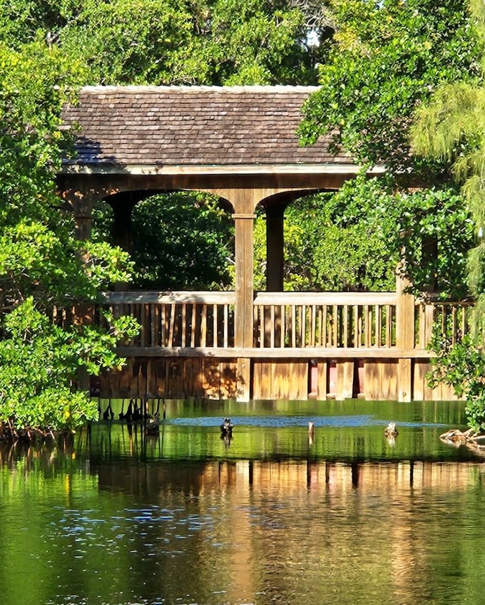 The bridge's reflection creates a perfect mirror image on still waters. Mother Nature showing off her symmetry skills in spectacular fashion.
