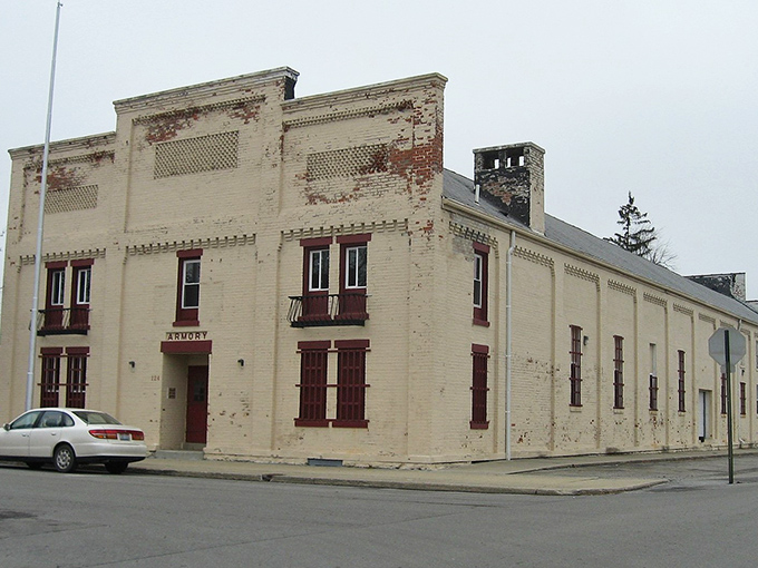 The old Armory's weathered facade tells tales of community gatherings and hometown heroes who once trained within its walls.