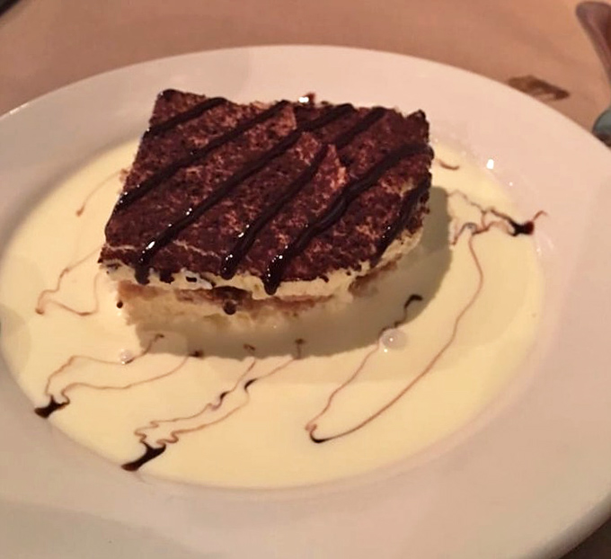 Tiramisu that transports you straight to an Italian grandmother's kitchen, where coffee-soaked layers and mascarpone create edible poetry on a plate.