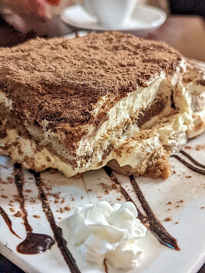 Tiramisu that deserves its own ZIP code. Those delicate layers of espresso-soaked ladyfingers and mascarpone cream make dieting seem like a terrible life choice.