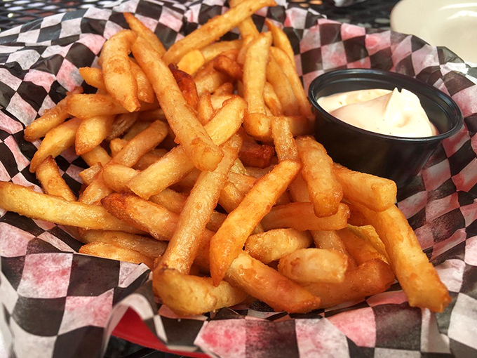 Fries so perfectly golden they deserve their own Instagram account. That little cup of dipping sauce? The perfect dance partner.