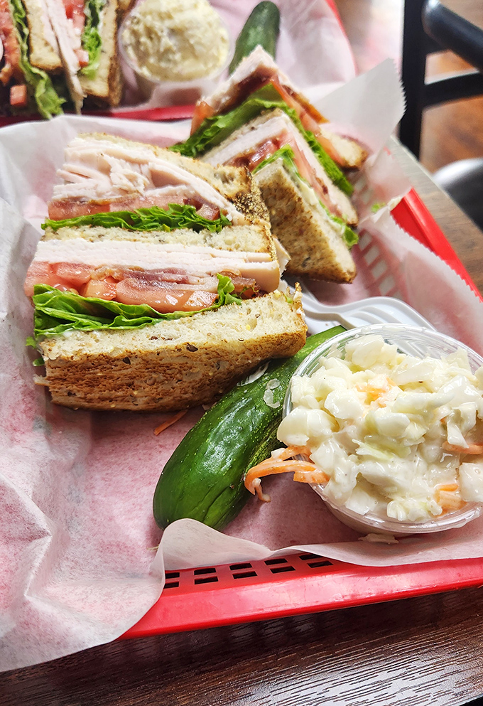 The turkey club arrives stacked like a delicious Jenga tower that you actually want to see collapse gloriously.