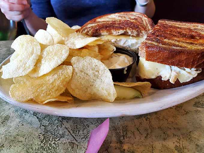 The perfect lunch combo: a golden-grilled sandwich with potato chips that crackle with each bite&mdash;simple pleasures at their finest.
