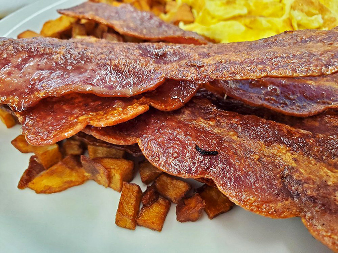 Bacon that achieves the impossible trifecta: crispy edges, meaty center, and that perfect savory chew. Breakfast's most loyal sidekick.