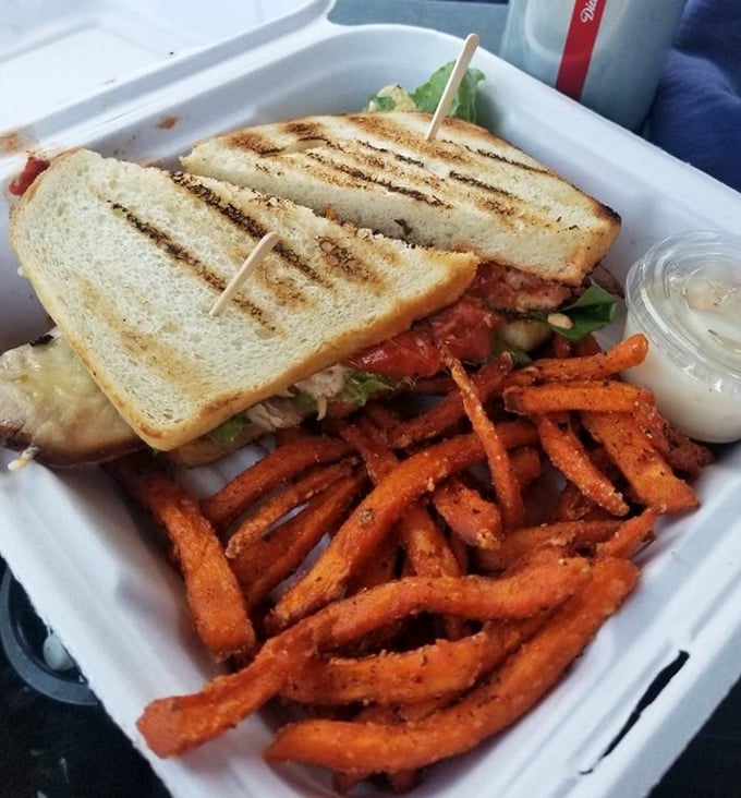 Vacation calories don't count, especially when they come in the form of this golden-grilled sandwich with sweet potato fries that redefine "side dish."